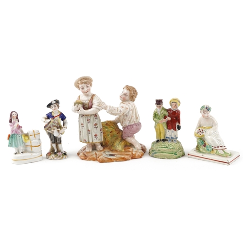 Five 19th century pottery figures including a continental figure group ...