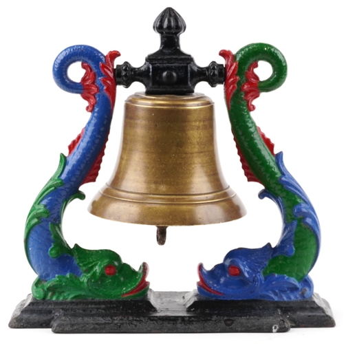 A Regency brass bell with a double dolphin cast iron support, later ...