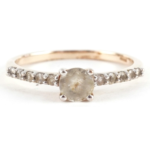 A 10ct gold white stone solitaire ring with white stone set shoulders ...