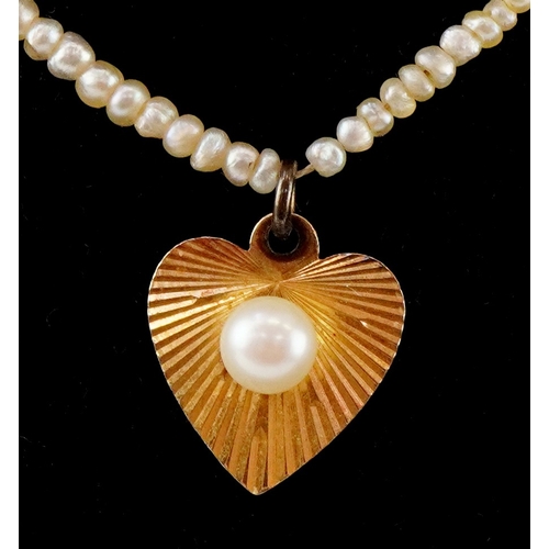 ***WITHDRAWN*** A 14ct gold cultured pearl engine turned love heart ...