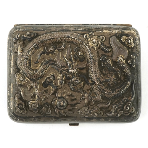 A Chinese export unmarked silver cigarette case profusely embossed with ...