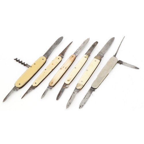 Six antique pocket knives including ivorine flanked examples, the ...