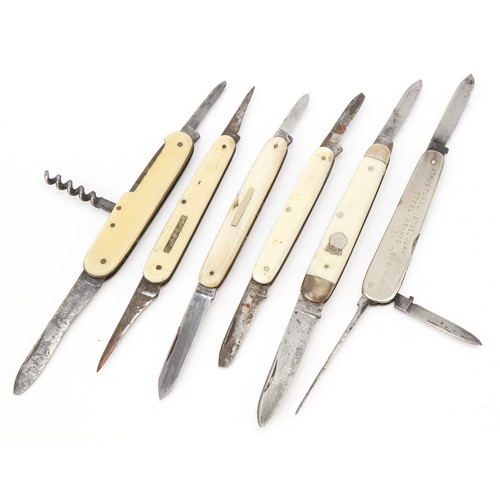 Six antique pocket knives including ivorine flanked examples, the ...