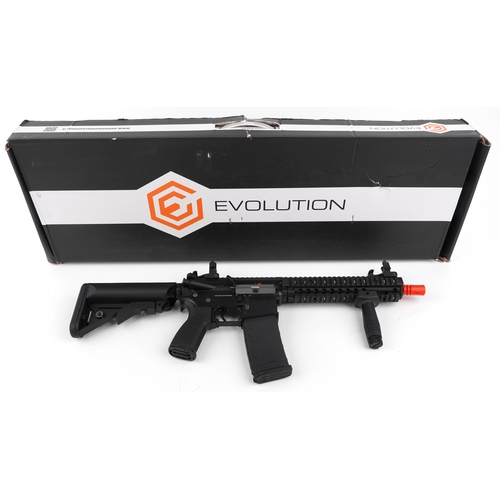 An evolution semi automatic 6mm Airsoft gun, 69cm in length.