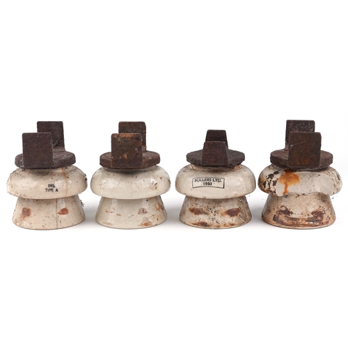A group of four mid 20th century ceramic and cast iron railway ...