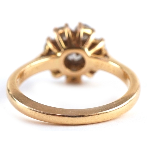 A Cartier 18ct gold diamond cluster ring, the largest diamond ...