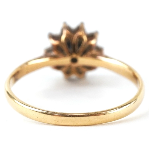 An 18ct gold sapphire and diamond two tier flower head ring, the ...