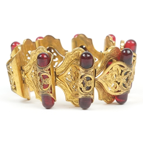 A vintage gilt metal and garnet style capsule design panel bracelet ...