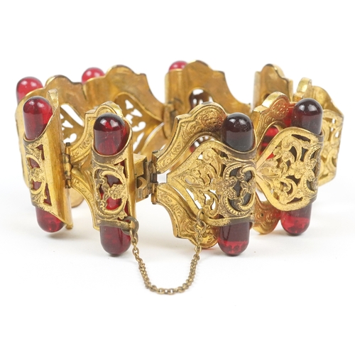 A vintage gilt metal and garnet style capsule design panel bracelet ...