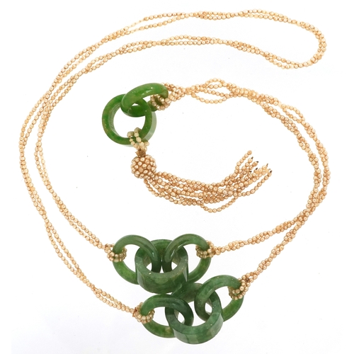 An Art Deco seed pearl and green jade necklace with interlocking rings ...