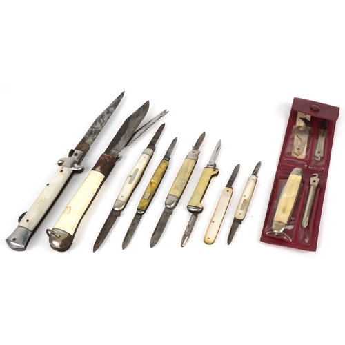 A collection of pocket knives and tools including mother of pearl ...