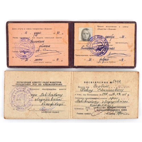 Three Russian military interest badges and paperwork including and ID card.