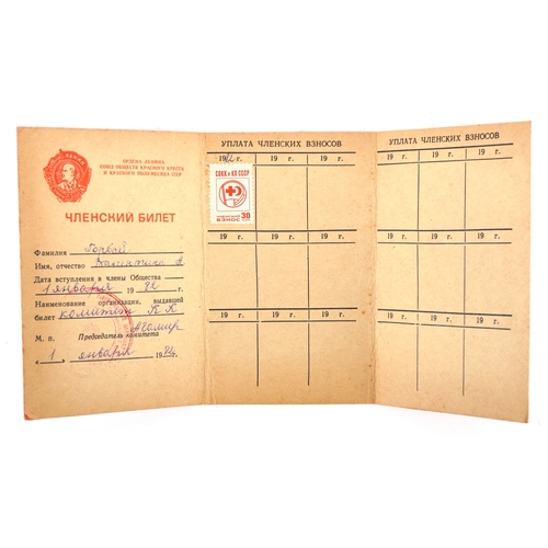 Three Russian military interest badges and paperwork including and ID card.