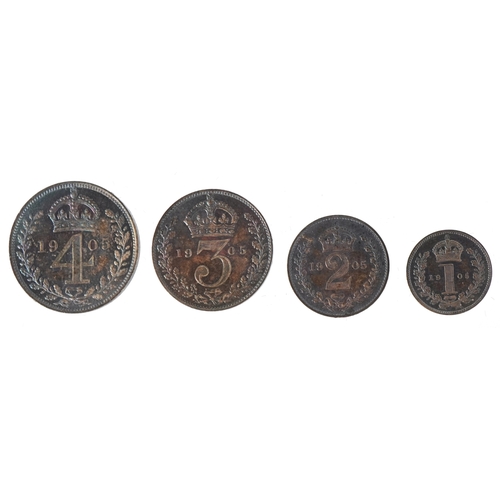 An Edward VII 1905 Maundy money coin set housed in a red presentation box.