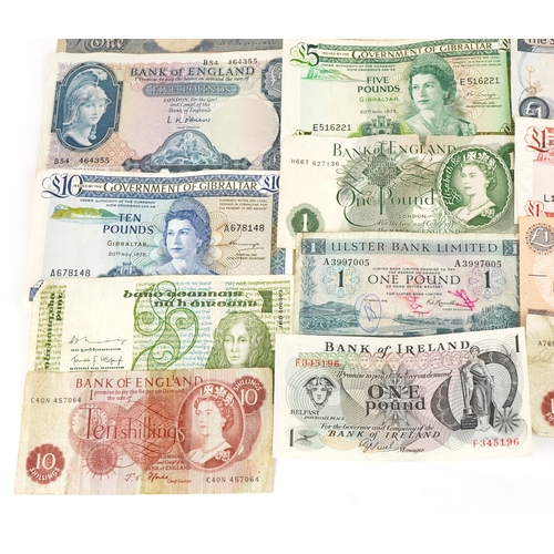 A quantity of vintage British and Commonwealth banknotes including a ...
