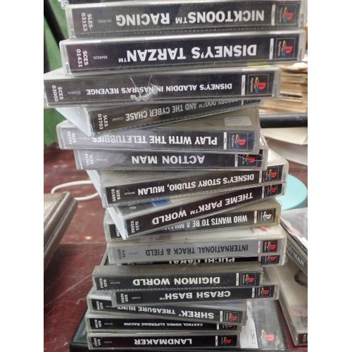 PLAYSTATION 2. WITH STACK OF GAMES.