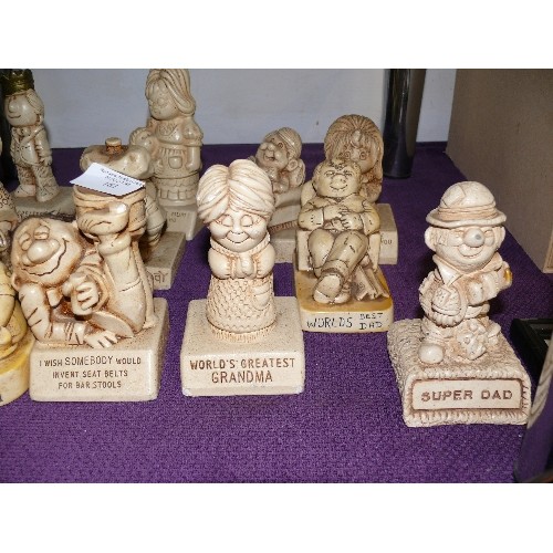 FOURTEEN RESIN COMICAL FIGURES WITH HUMOROUS MOTTOS.