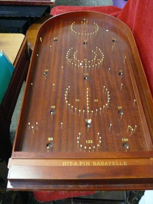 A VINTAGE HIT-A-PIN BAGATELLE GAME.