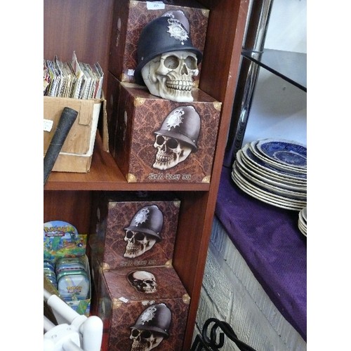 SIX BOXED SKULL MONEY BOXES.
