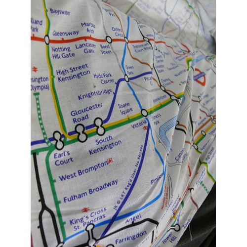 A LARGE ROLL OF LONDON UNDERGROUND TUBE MAP MATERIAL.