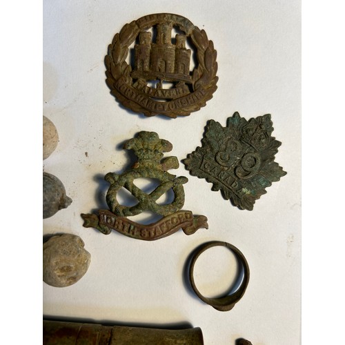 Metal detecting finds including lead musket balls, toy soldier, turtle ...