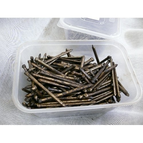 A SELECTION OF VARIOUS TUBS OF NAILS