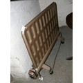A VINTAGE DIMPLEX OIL FILLED RADIATOR IN A GOLD FINISH, WITH PERIOD ...