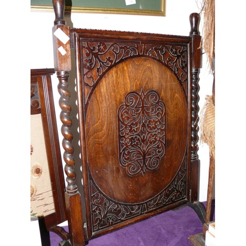 1920'S WOODEN FIRESCREEN WITH BARLEYTWIST SUPPORTS AND BLIND FRETWORK PANEL