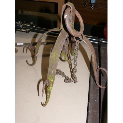 Small crown of antique wrought iron game hooks.