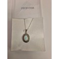 An opal and marquesite set pendant, the oval opal of good colour, 12.6 ...