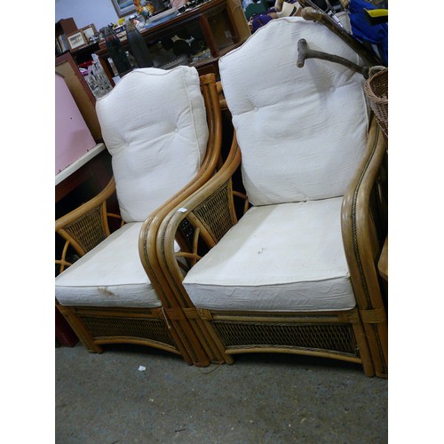 PAIR OF CANE CONSERVATORY ARMCHAIRS WITH CREAM CUSHIONS