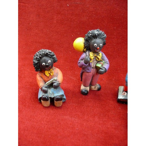 A collection of 12 Robertson marmalade advertising Golly figurines ...