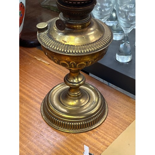 Victorian brass Globe Vulcan oil lamp, with an etched cranberry glass ...