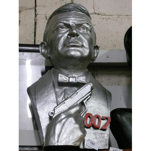 James Bond 007 head statue and a black & white photo of Sean Connery as ...