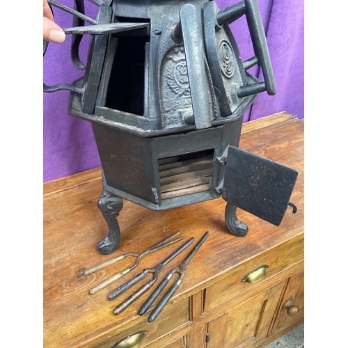Victorian cast iron pot belly laundry stove, complete with 9 flat irons ...