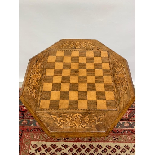 A small 19th century octagonal gaming table, with inlaid decoration and ...