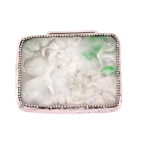 A carved jadeite plate buckle, the rectangular jadeite plaque of pale ...