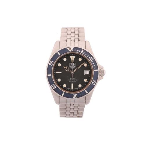 A Tag Heuer Professional 1000 series quartz wristwatch, the black dial ...