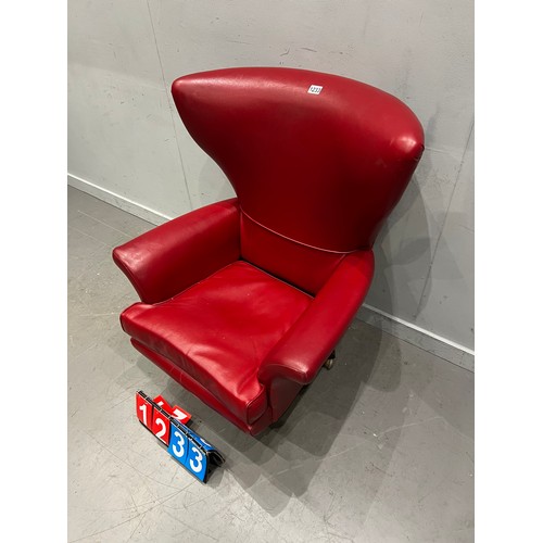 Mid century red leather wing back swivels chair