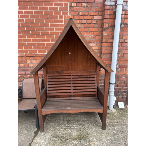 Good shaped garden bench with canopy top