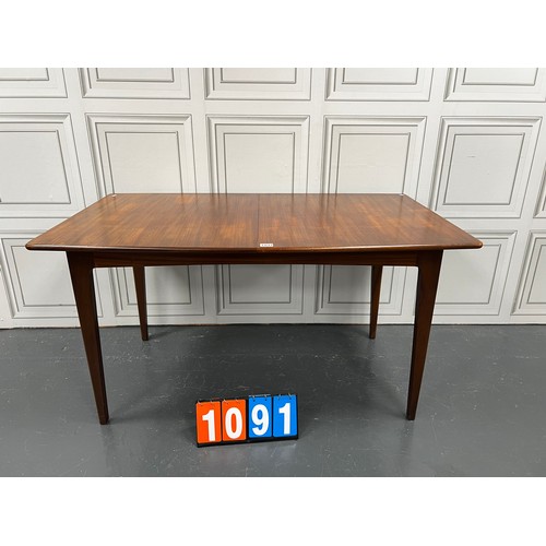 A. Younger mid century teak dining table
