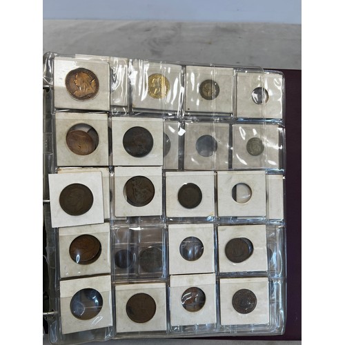 A good folder of antique and vintage coins including coin holders