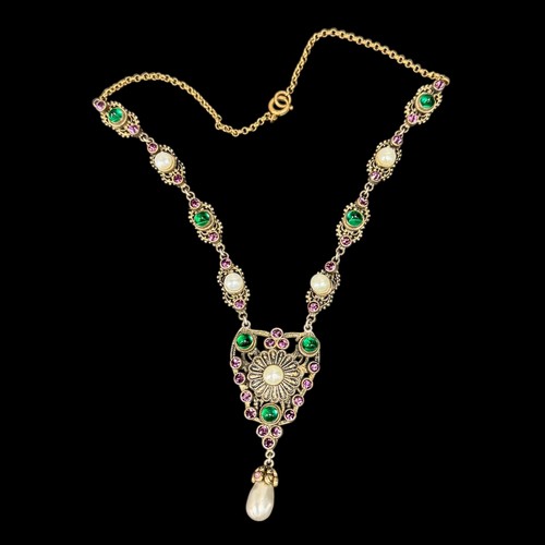 A 1920s Max Neiger Art Deco brass pendant necklace, chain with purple ...
