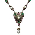 A 1920s Max Neiger Art Deco brass pendant necklace, chain with purple ...