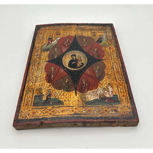 A 19TH CENTURY GREEK OR RUSSIAN ORTHODOX GILDED ICON ON WOOD DEPICTING ...
