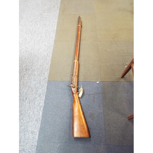 An antique flintlock musket stamped 2160