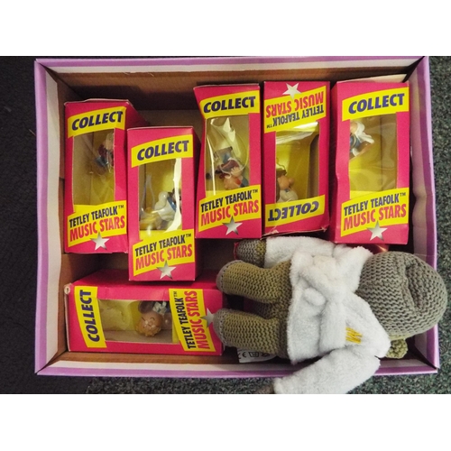 A selection of boxed musical Tetley tea folk figures and monkey