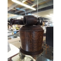 A vintage wooden pipe and tobacco jar