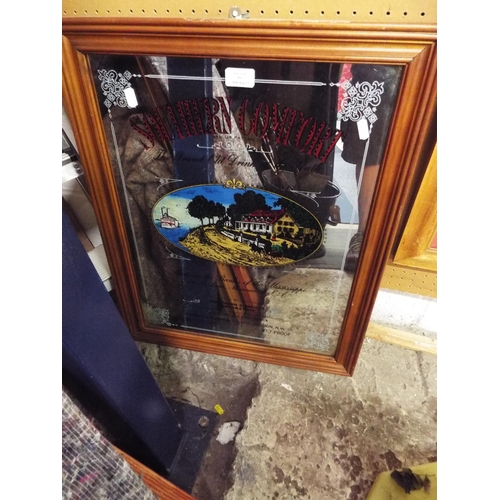 A framed Southern Comfort advertising mirror