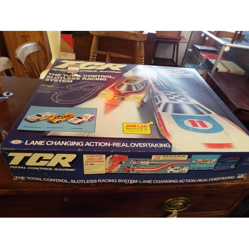 A boxed TCR Total Control Racing system lighted jam car speedway 23 feet